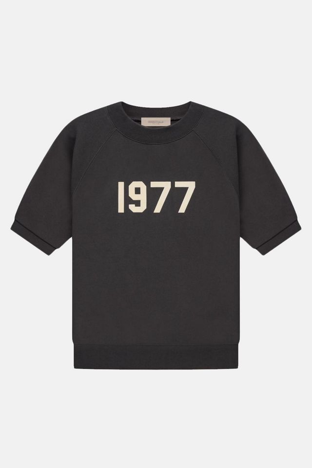 Fear of God Essentials 1977 SS Raglan Crewneck | Urban Outfitters
